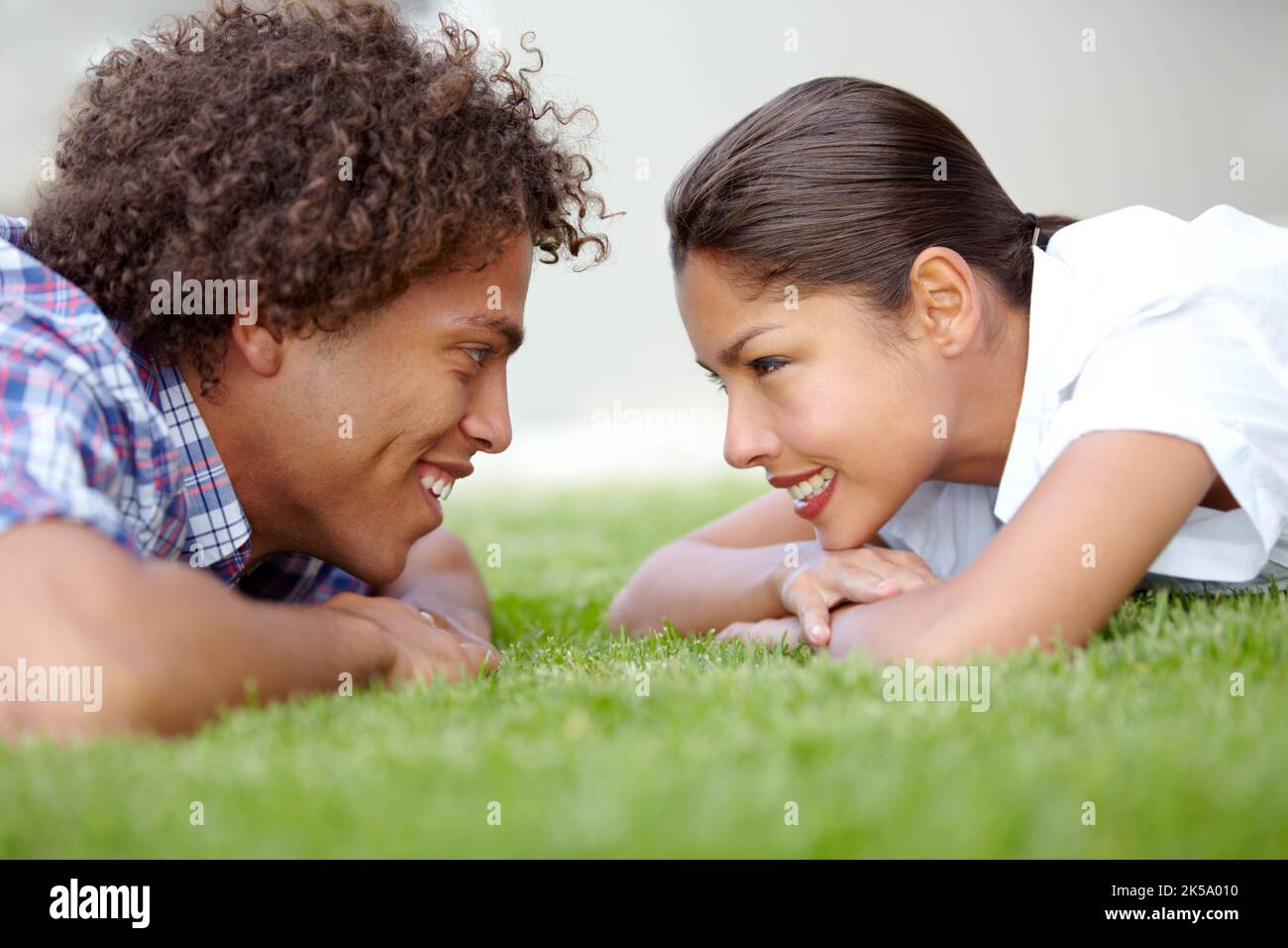 Were a great match. a happy young couple gazing into each others eyes ...