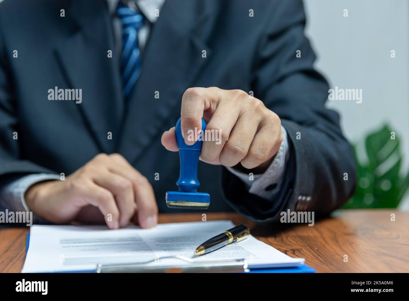 Man stamping approval of work finance banking or investment marketing ...