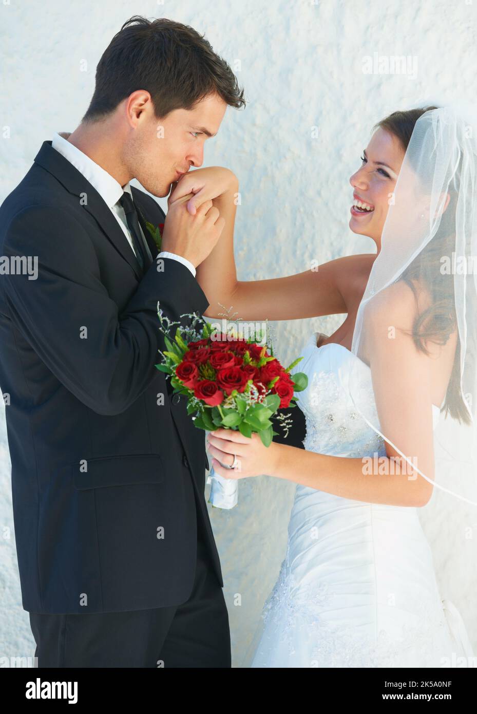 Standing groom kissing hand hi-res stock photography and images - Alamy