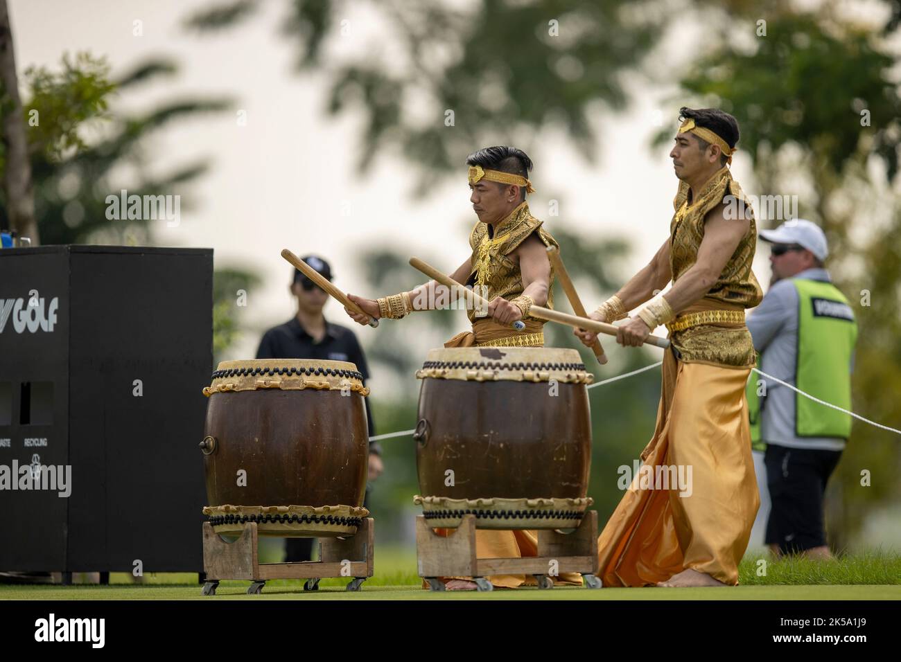 BANGKOK, THAILAND - OCTOBER 7: Thai traditional drummers on hole 8 ...
