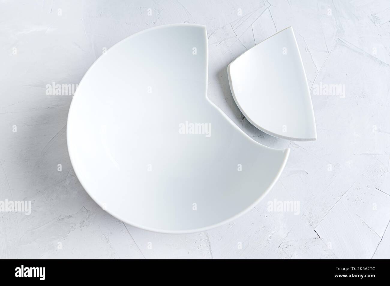 Top view of a broken white bowl placed on a concrete background Stock ...