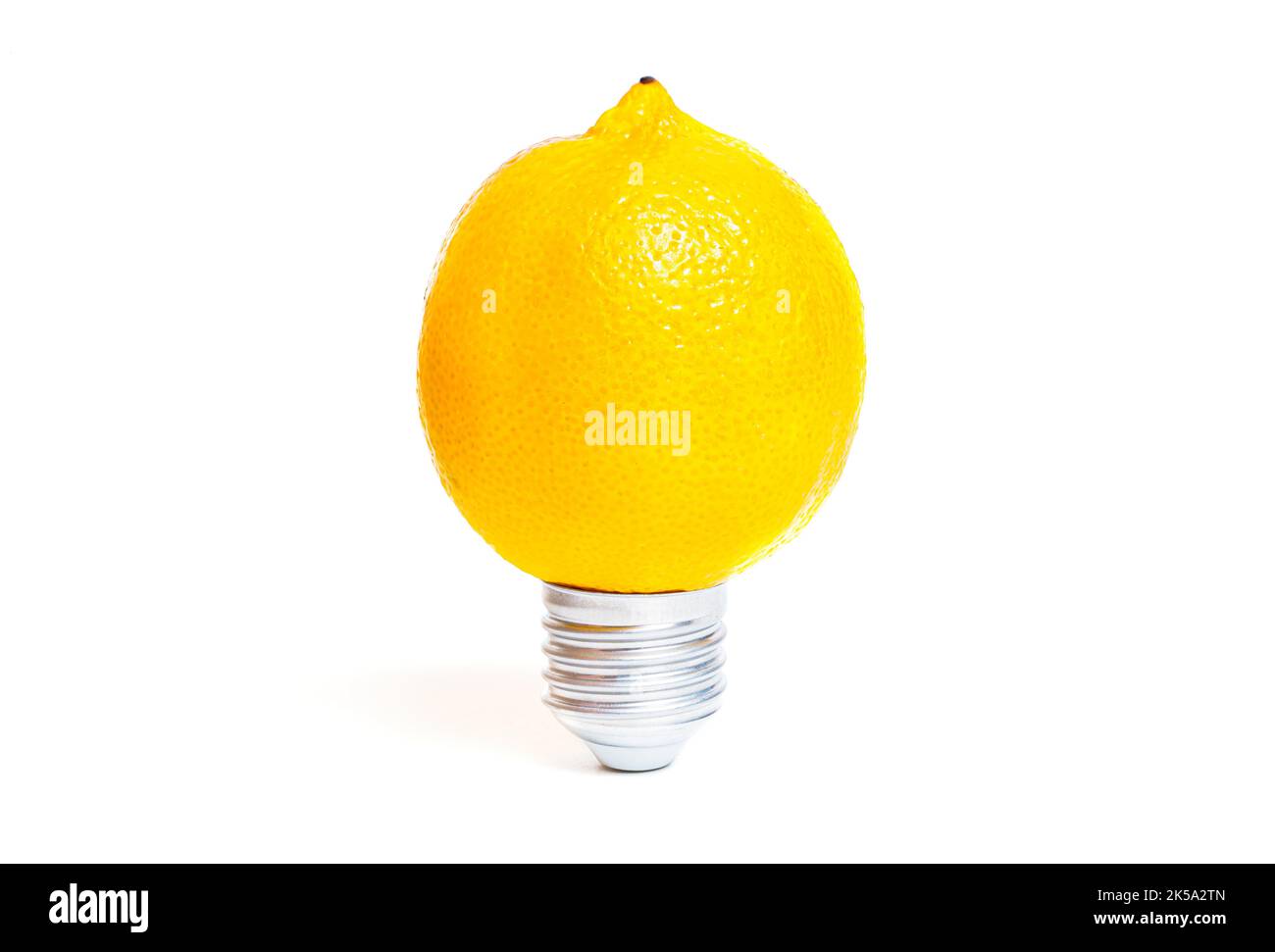 Light bulb shape made from a fresh lemon isolated on white background ...