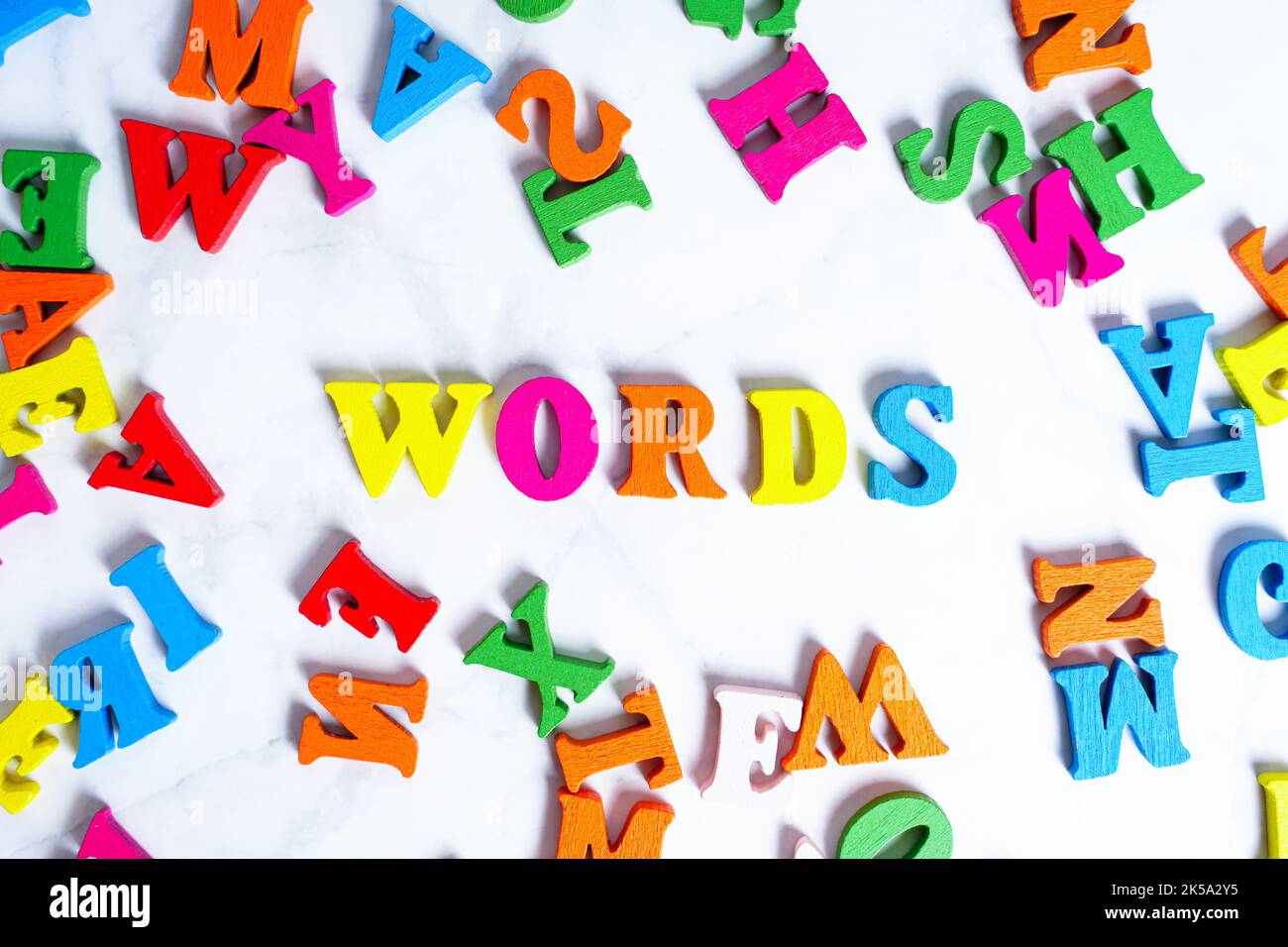 Lettering WORDS made from colorful wooden characters on gray. Bright ...