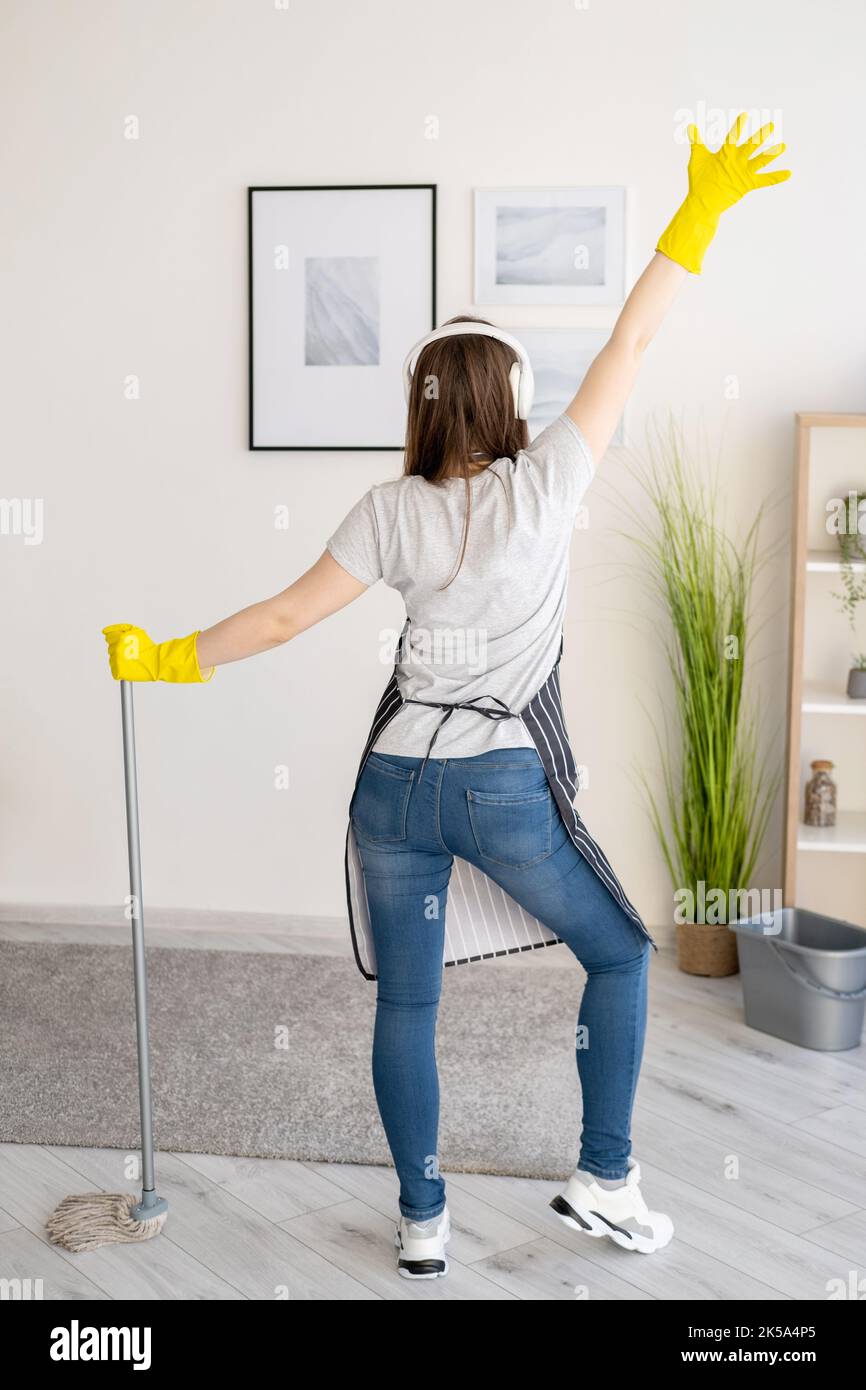 Happy cleaning. Enjoying home chores. Housewife routine. Joyful funny ...