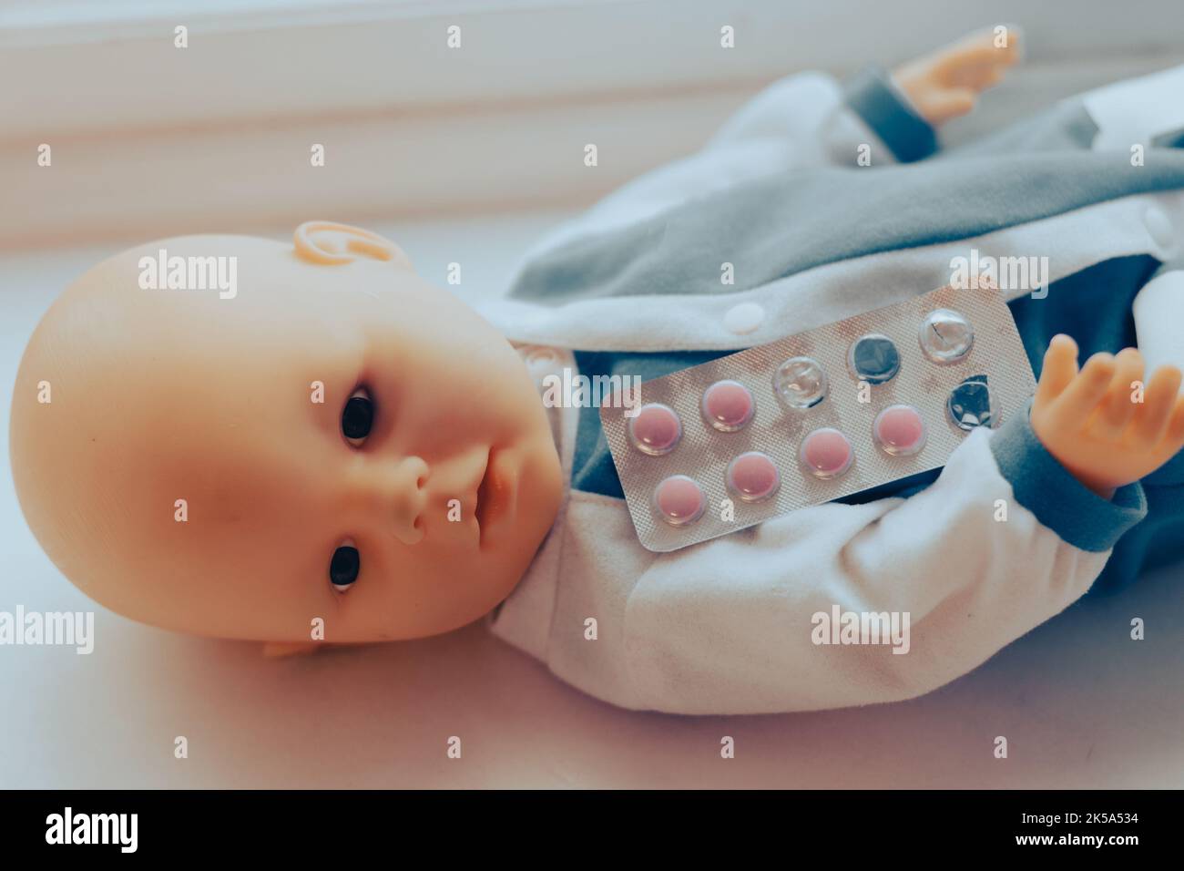 baby doll with pills. child abuse concept. High quality photo Stock ...