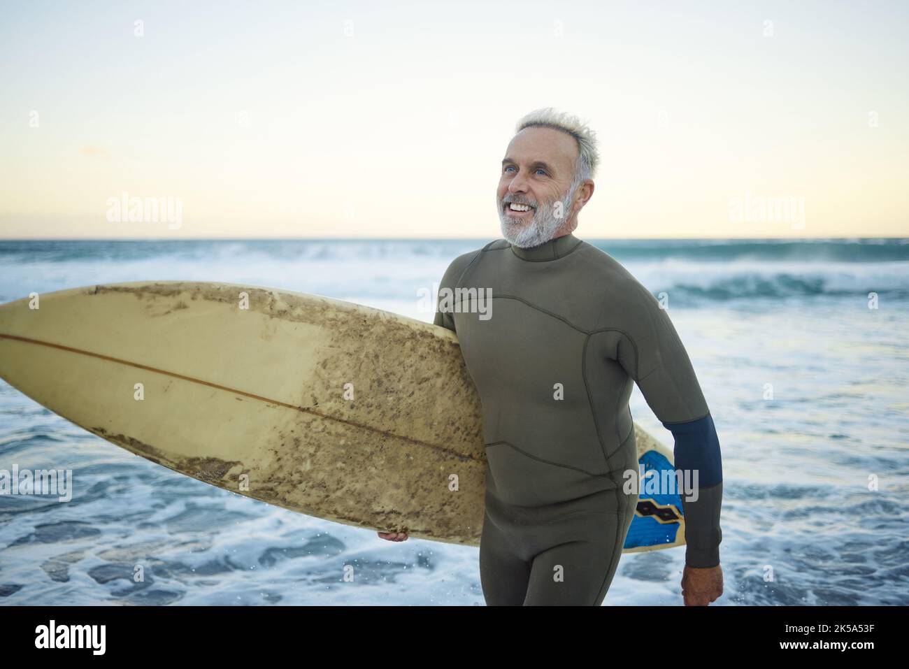 Water, happy and man surfing at the beach on a tropical holiday in ...