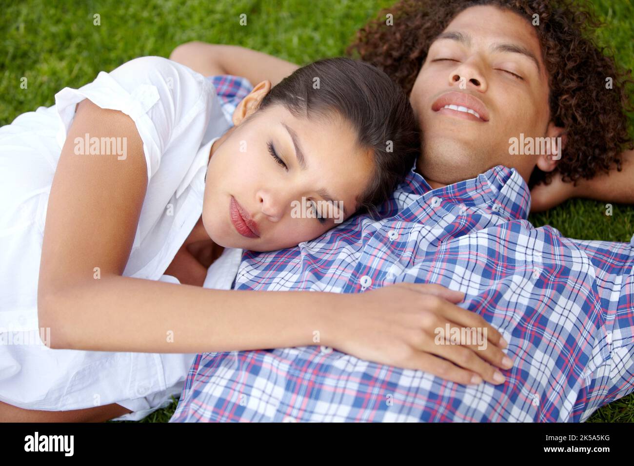 Comfortable with each other. a happy young couple napping together on ...