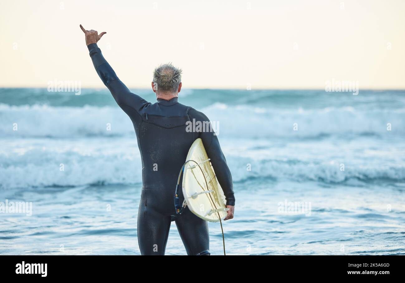 Beach, freedom and man surfing on holiday by the sea in Australia for ...