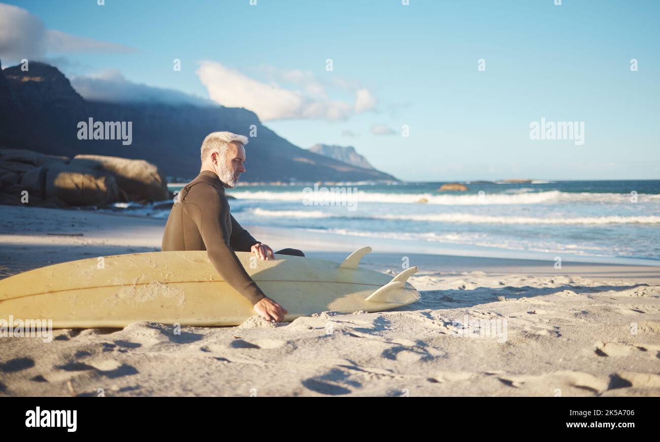 Surf, relax and senior man on the beach for sports, surfing and fun ...