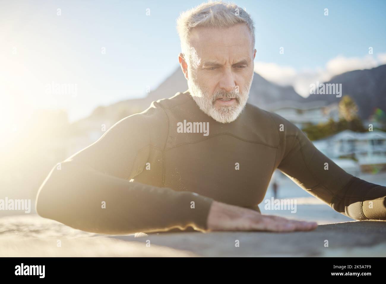 Beach, surfing and man cleaning his board on holiday in Hawaii for ...