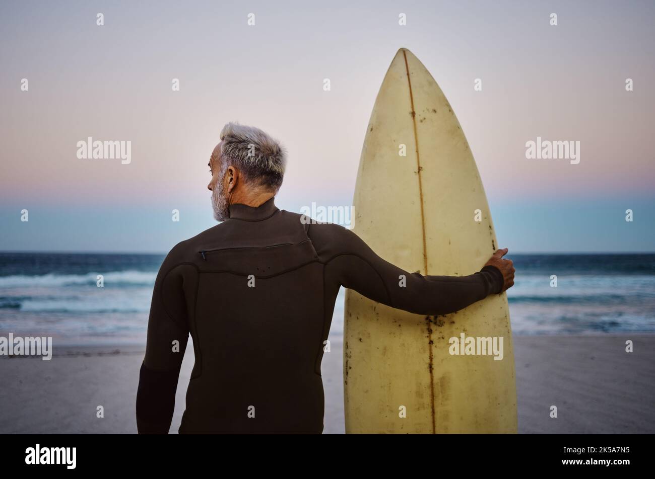 Beach, man and surfboard with back view for morning cardio fitness and ...