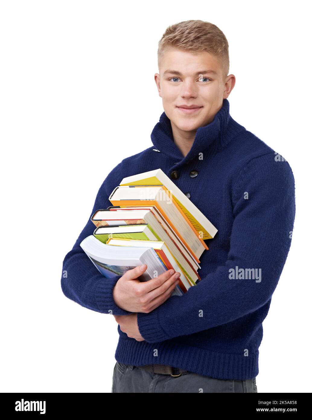 Ready to hit the books. Portrait of a young university student holding ...