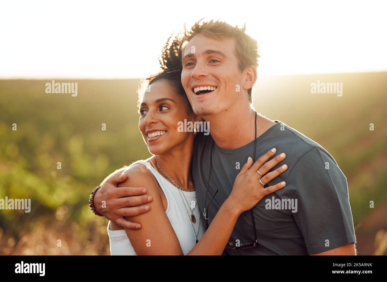 Love, countryside and couple smile, smile and bonding together on a ...