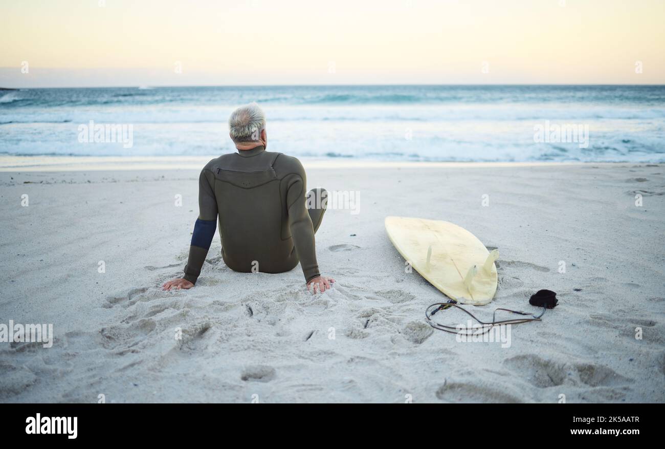 Beach, back view and old man surfer on holiday vacation in retirement ...