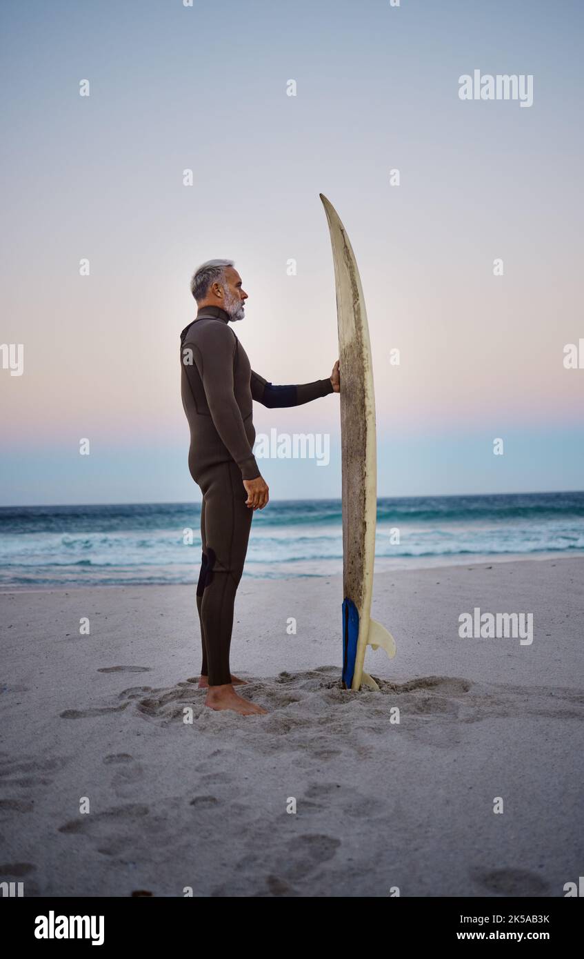 Surfing, surfboard and senior man on beach for water sports adventure ...