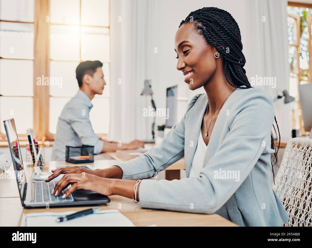 Finance black woman, office and laptop typing corporate business ...