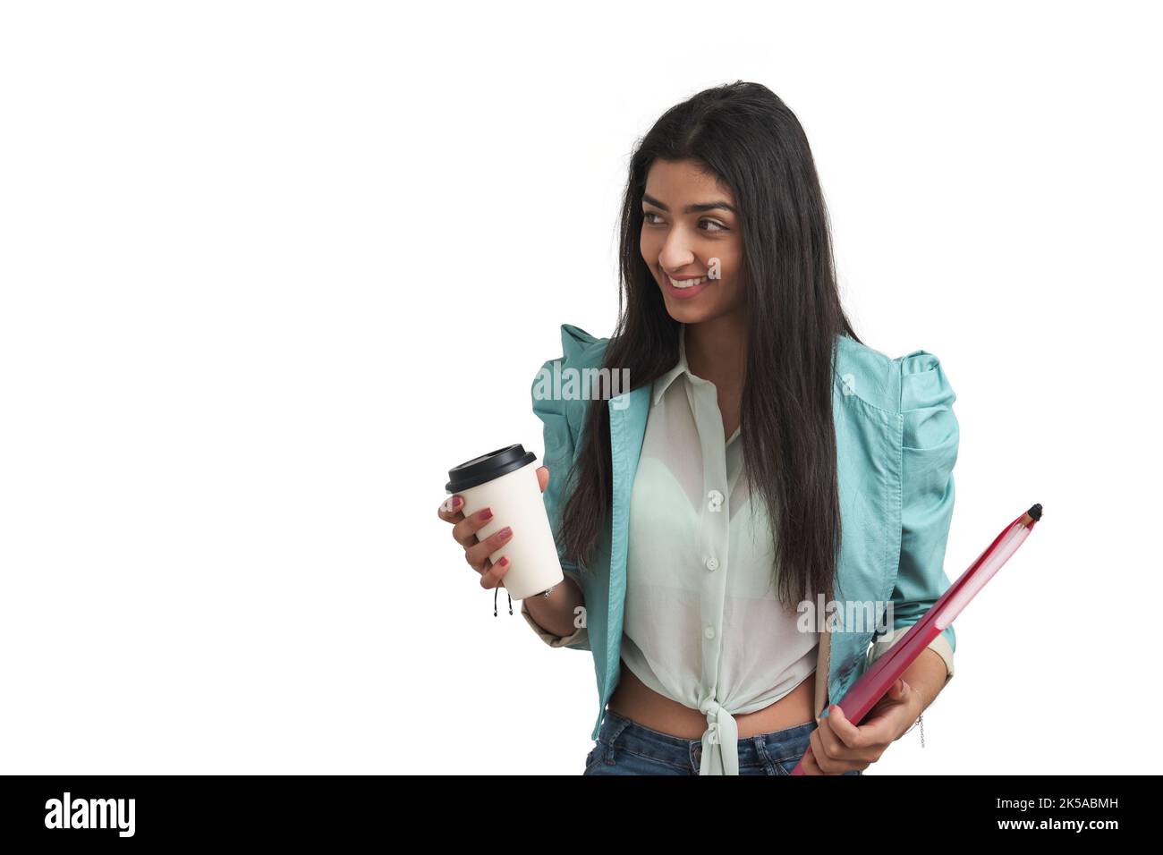 Young Venezuelan woman smiling with coffee and folder, isolated Stock ...