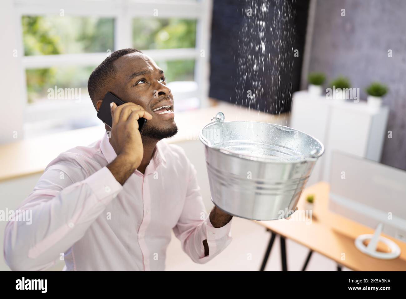 Water Pipe Leak And Flood. Emergency Call Stock Photo - Alamy
