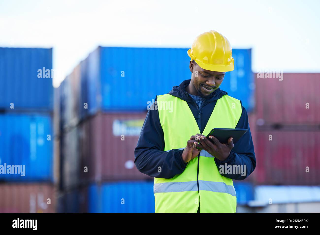 Logistics, digital tablet and black man in supply chain management at ...