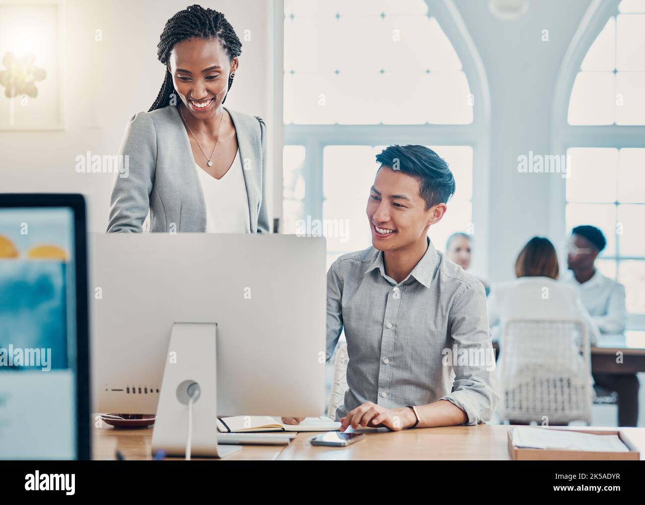 Employees, coworkers and training with computer doing research ...