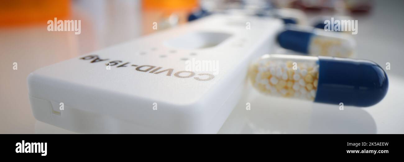 Express test for covid 19 antigen lying among many medical capsules ...