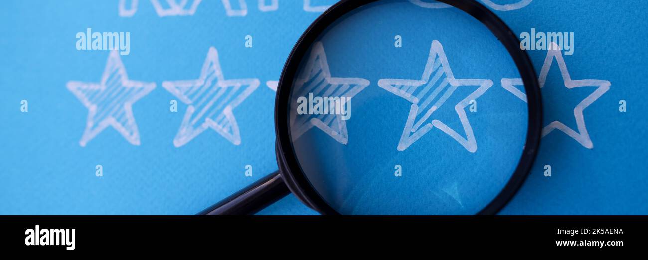 Lens lying on five stars of assessment of quality of service blue ...