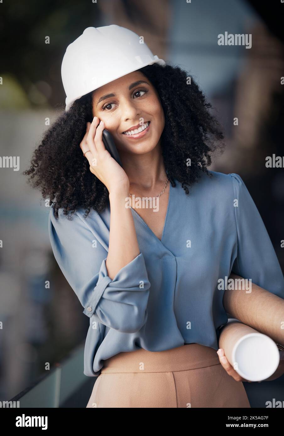 Architect, phone call and black woman talking on smartphone, holding ...