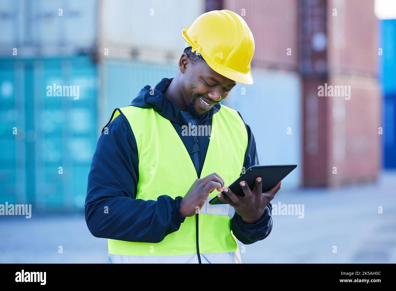 Logistics, tablet and black man doing container shipping at an ...