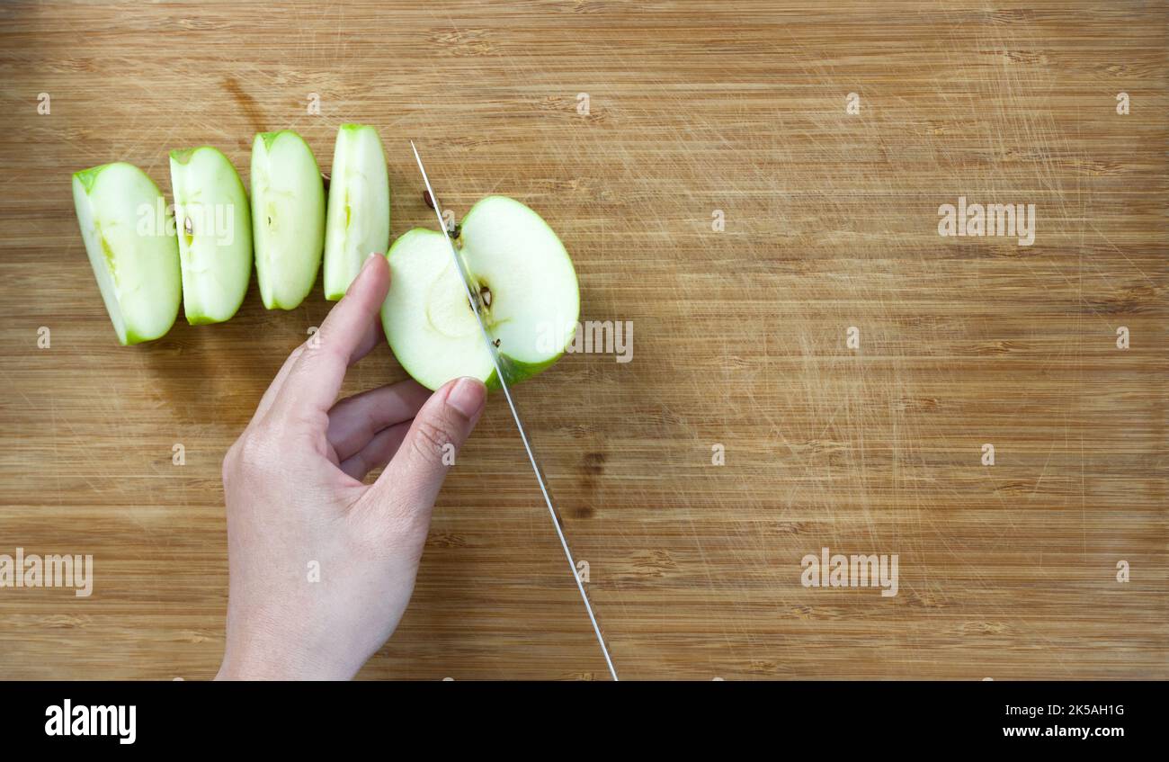 Woman hand cut chop green hi-res stock photography and images - Alamy