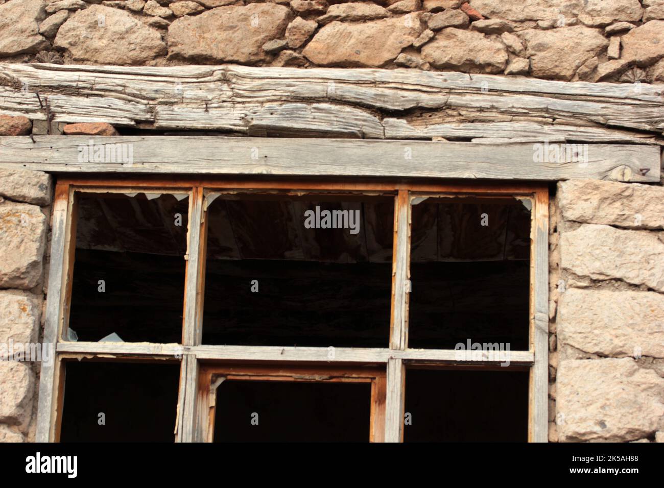broken window of an abandoned stone house Stock Photo - Alamy