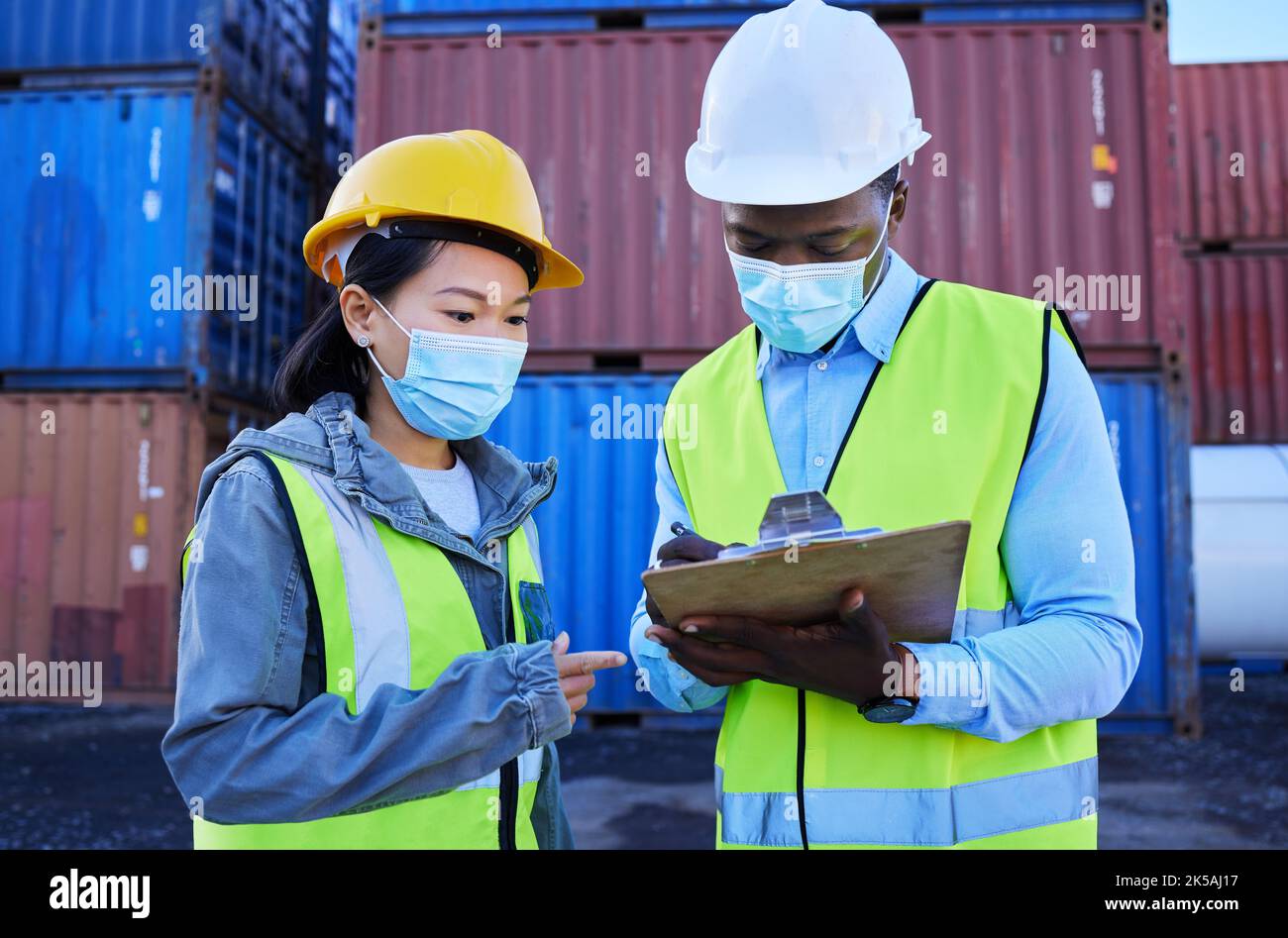 Covid, documents and supply chain logistics with a team working in ...