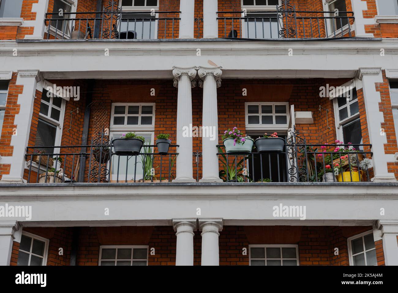 Low angle view of a traditional red brick apartment block with ...