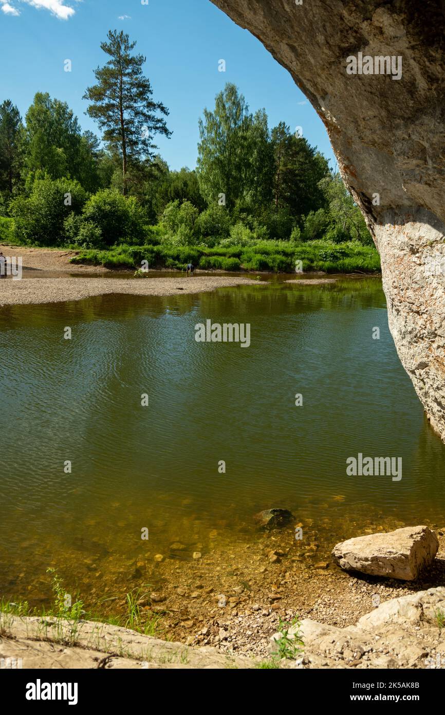 View from mountain cave at nature river water. View of the river, lake ...