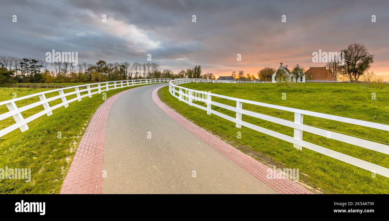 Dutch Countryside landscape with historical houses in evening along a ...