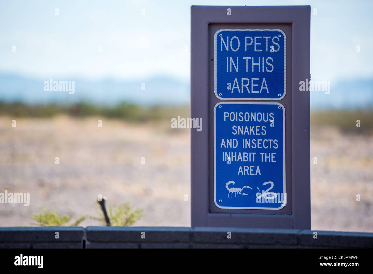 The blue signs: no pets in this area, poisonous snakes and insects ...