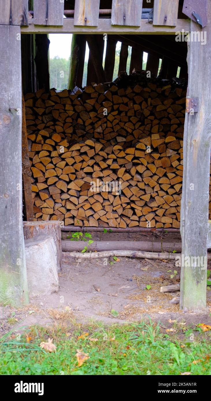 Stacked chopped firewood for heating for the winter period. heat energy ...