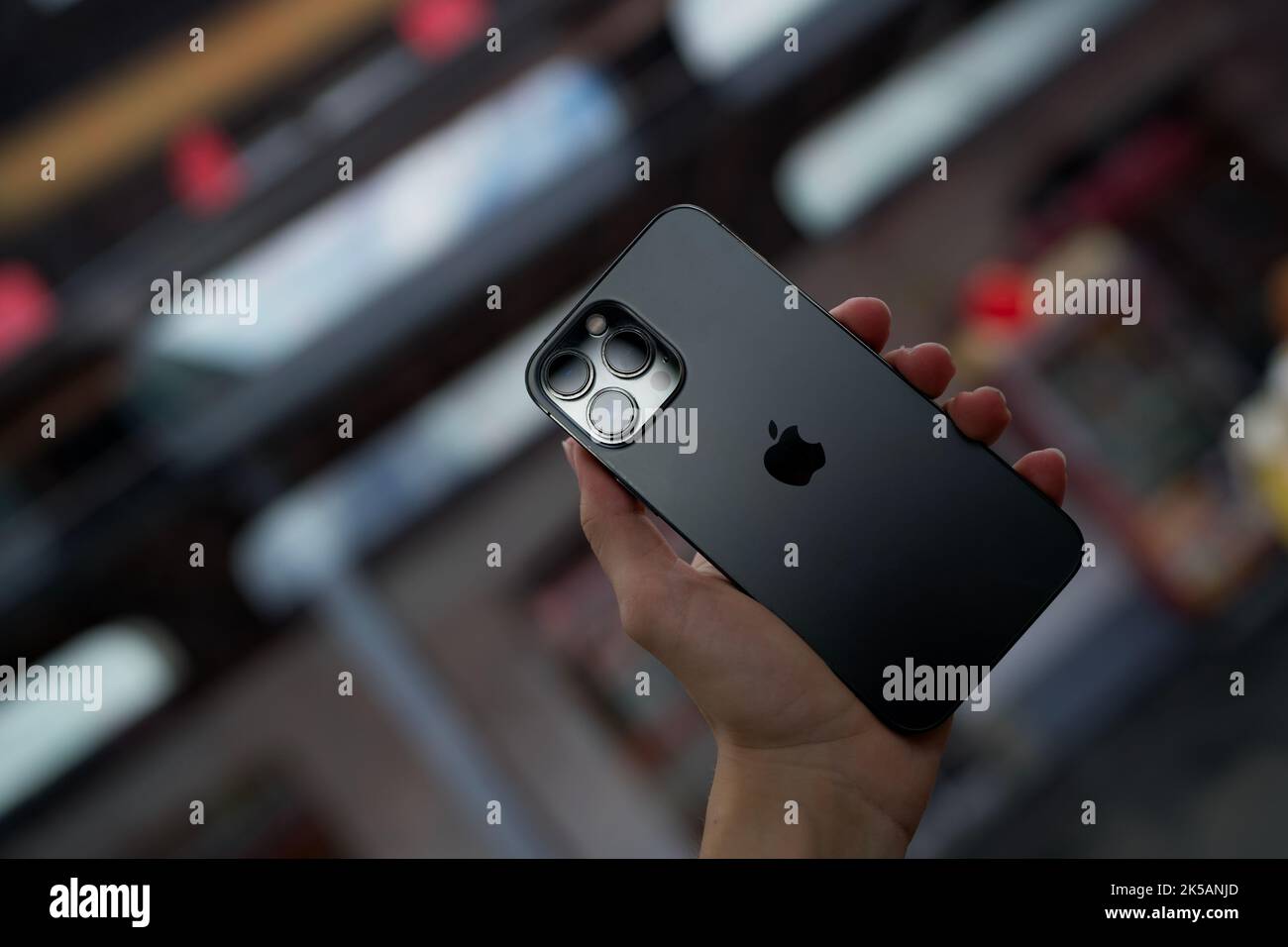 Iphone 13 holding hi-res stock photography and images - Alamy