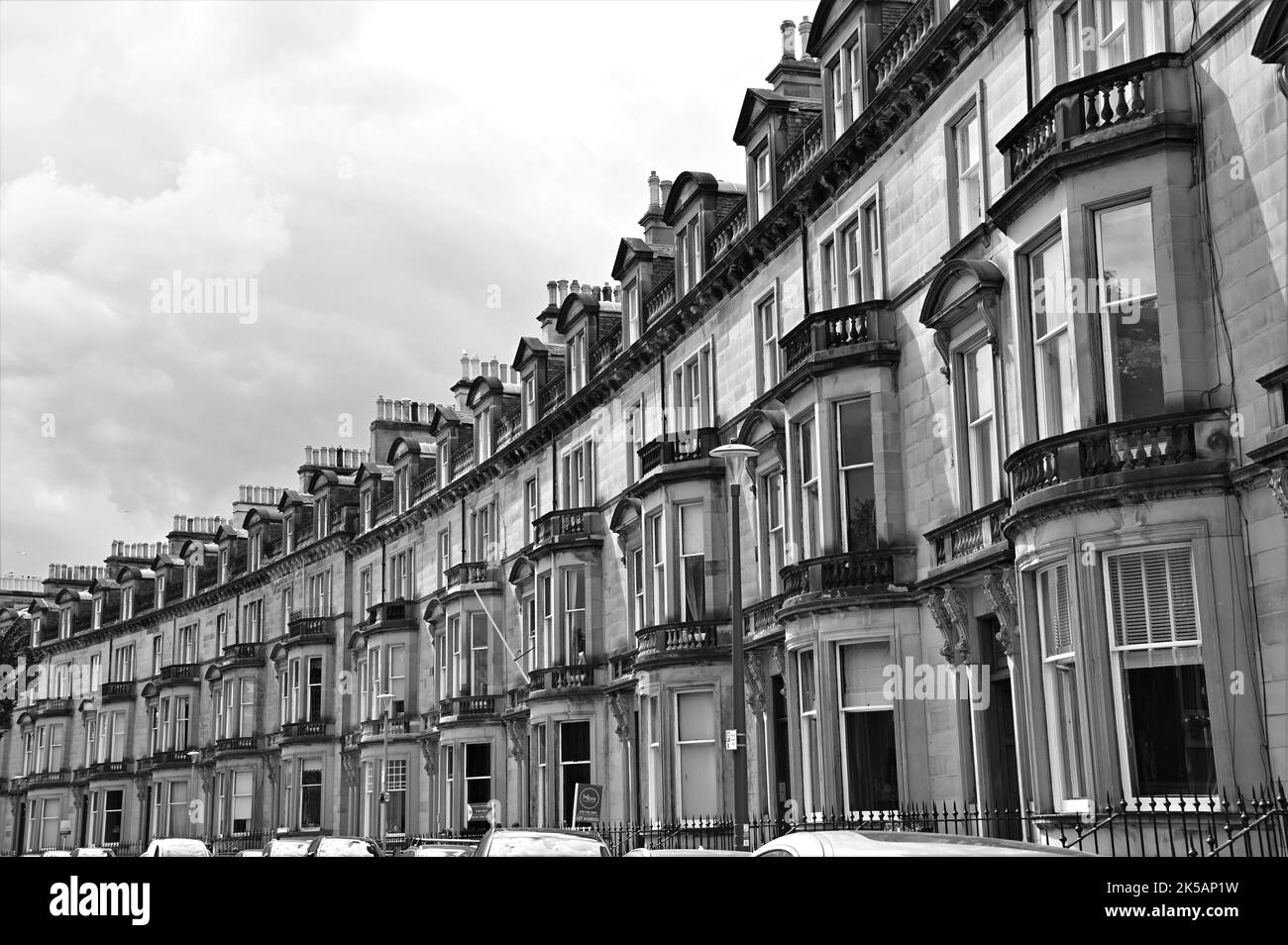 An exterior view of a row of houses in a crescent shape in the new town ...