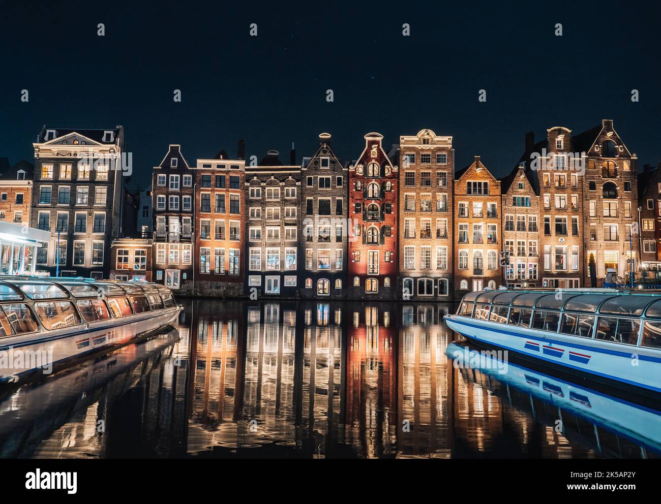 Dancing Houses Damrak Amsterdam during the night Netherlands Holland ...