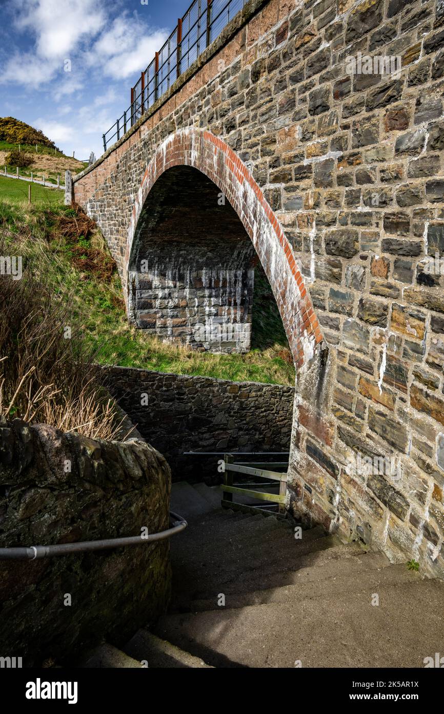 Stairs leading under a stone bridge in Buckie on Moray Firth coast of ...