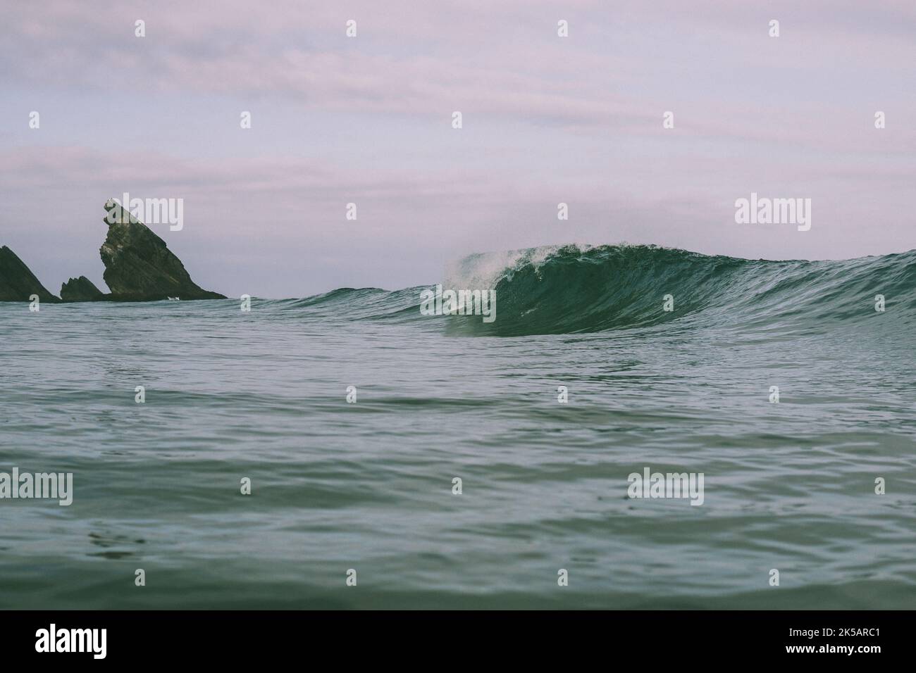 A gorgeous view of a dark green sea with vicious tides rising and ...