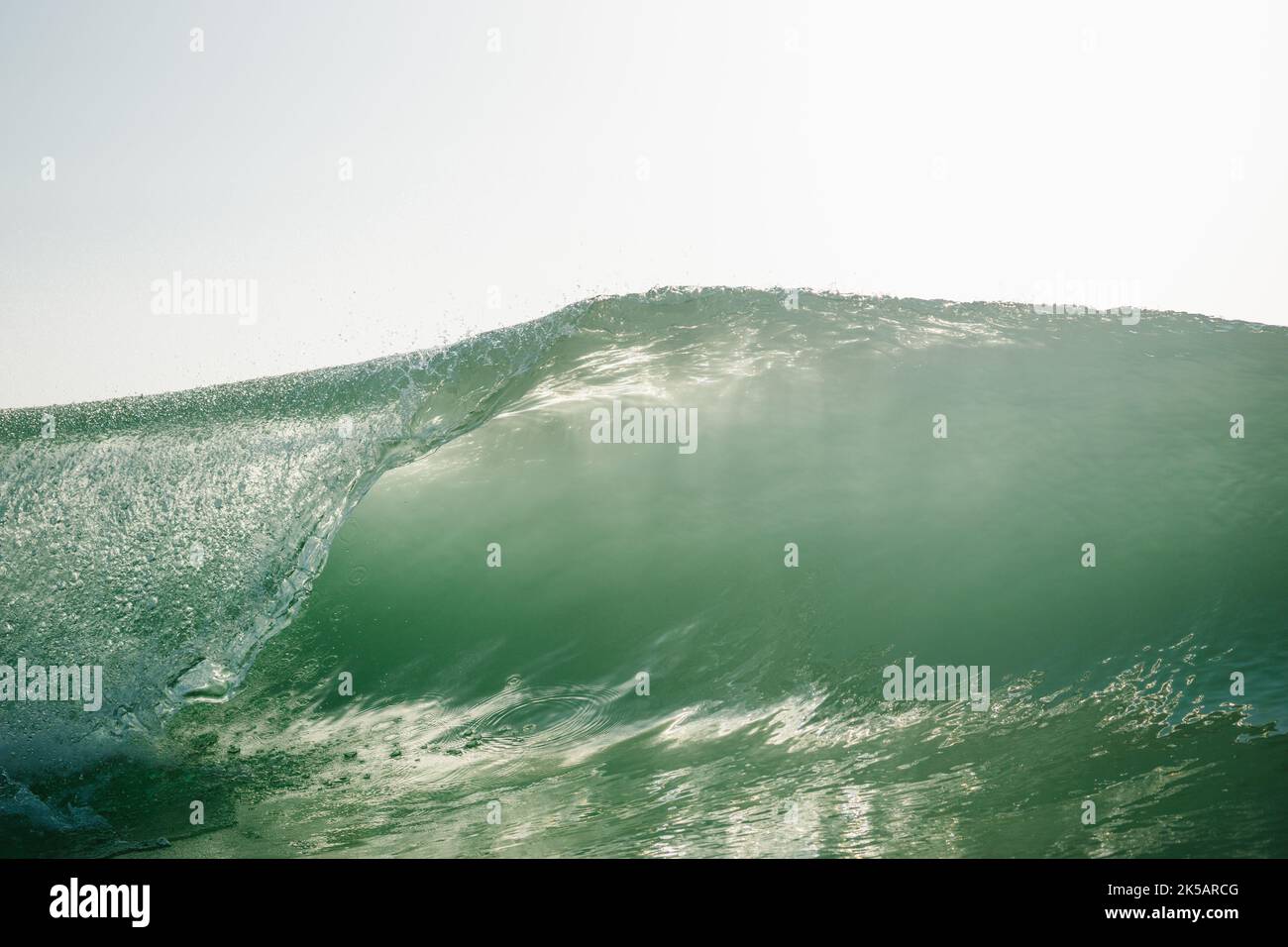 A gorgeous view of a bright green sea with vicious tides rising and ...