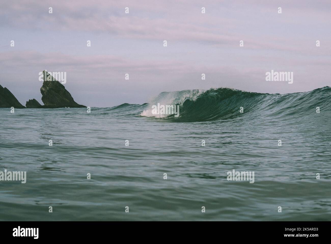 A gorgeous view of a dark green sea with vicious tides rising and ...