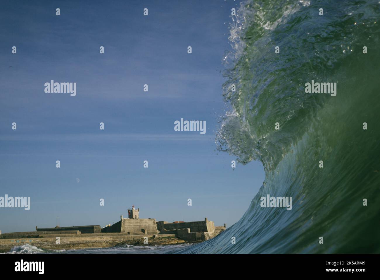 A gorgeous view of a bright green sea with vicious tides rising and ...