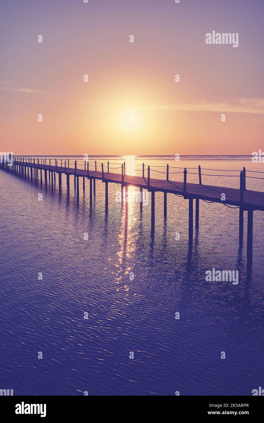 Wooden pier silhouette at sunrise, color toning applied Stock Photo - Alamy