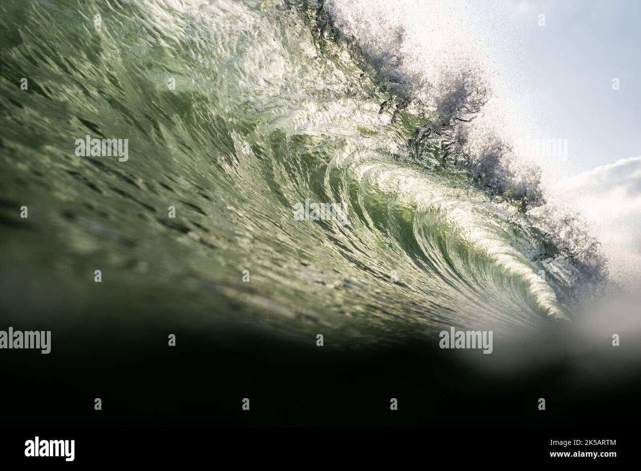 A gorgeous view of a bright green sea with vicious tides rising and ...