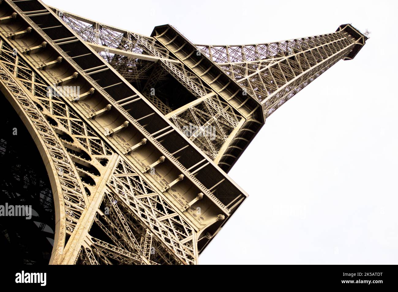 A low angle of the Eiffel tower isolated on a white background Stock ...