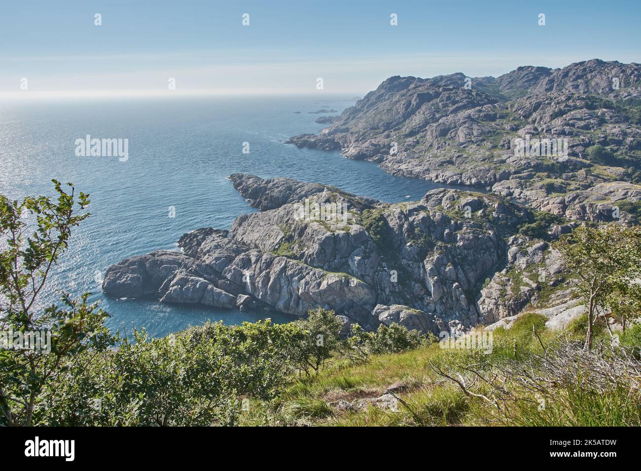 A beautiful landscape of rocky cliffs facing the sea in Flekkefjord ...