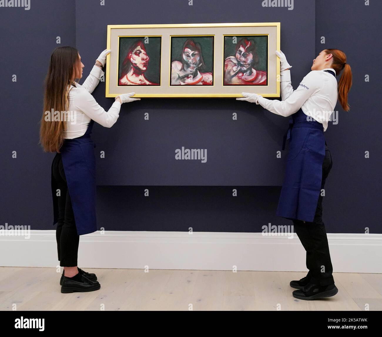 Technicians handle 'Three Studies for Portrait of Henrietta Moraes' by ...