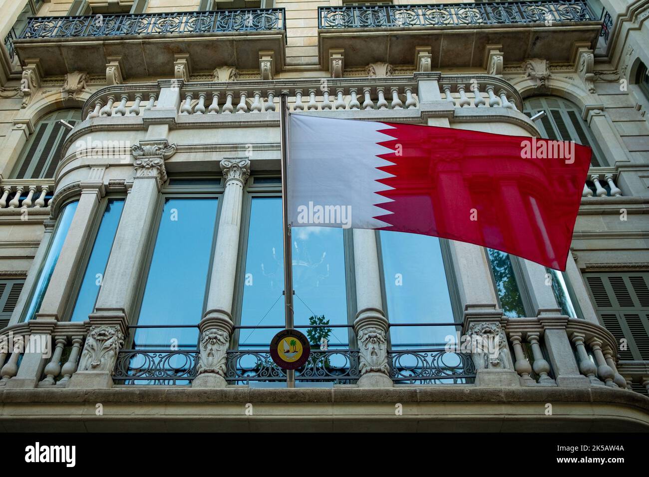 A flag of Qatar hangs outside the Consulate of Qatar in Barcelona along ...